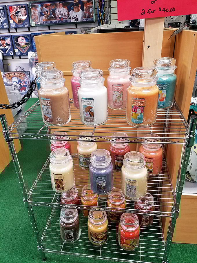 Yankee Candle jars stacked like aromatic architecture, ready to make your home smell infinitely better than teenage boy's bedroom.