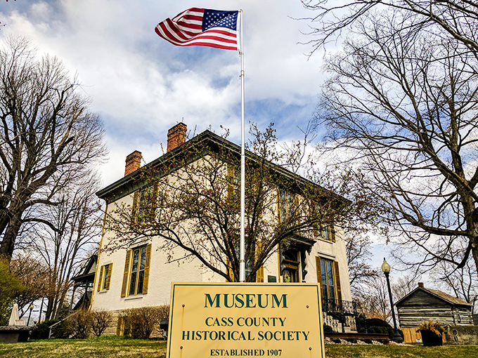 The Cass County Historical Society Museum stands proudly beneath Old Glory, preserving stories that predate both the internet and sliced bread.