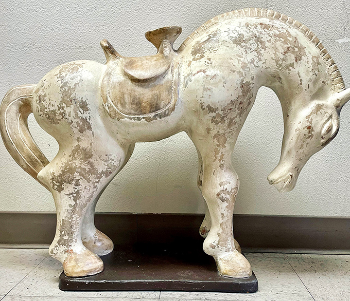 This majestic ceramic steed isn't horsing around. A conversation piece that galloped in from someone's past, now waiting for its next decorative adventure.
