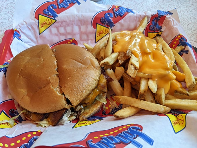 This isn't just a burger—it's architecture. Those cheese fries aren't a side dish; they're a religious experience waiting to happen.