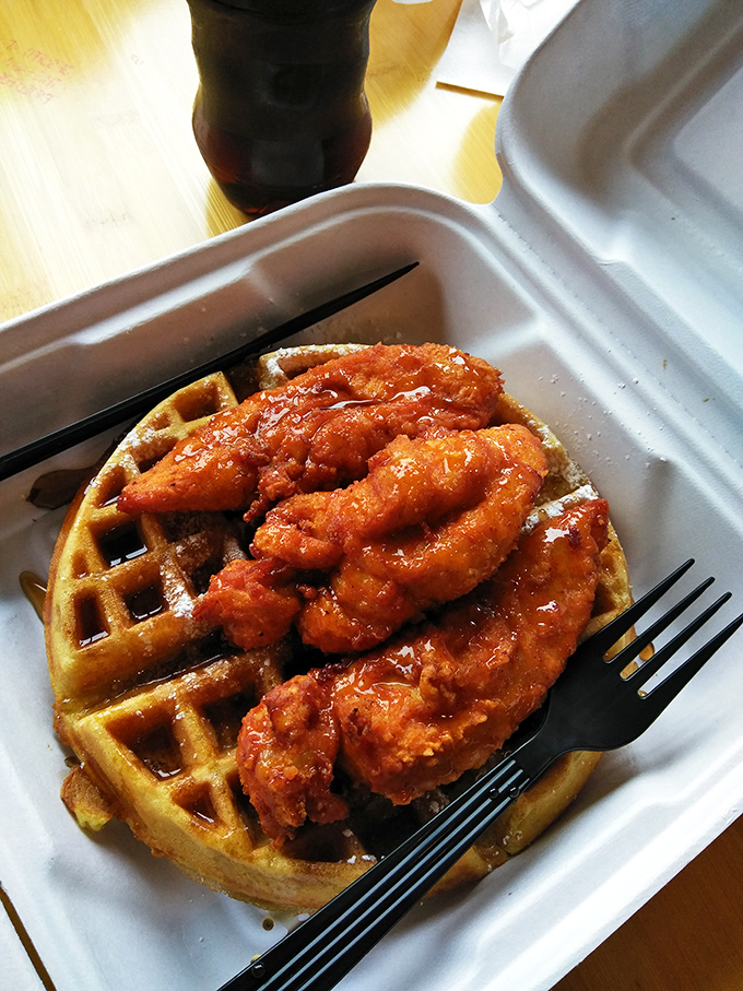 The holy grail of comfort food combinations, where crispy chicken meets fluffy waffles in sweet and savory harmony.