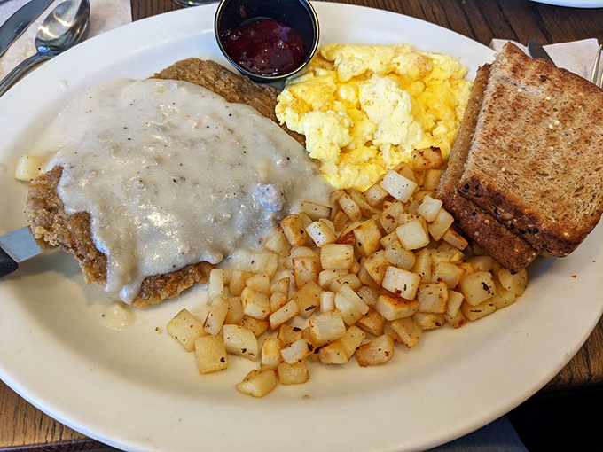 Country-fried steak smothered in gravy that could make a vegetarian temporarily question their life choices. Comfort food at its most comforting.