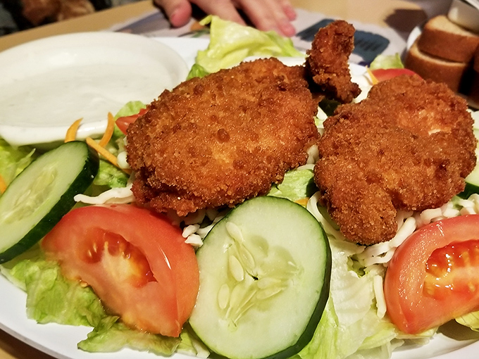 Fresh greens topped with crispy chicken&mdash;when salad stops being punishment and becomes a celebration.
