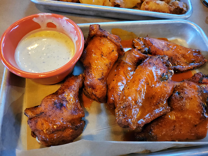 Wings glazed to golden perfection with enough sauce to require extra napkins and zero regrets about ordering them.