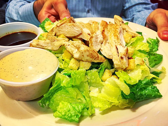 That Caesar salad arrives with enough grilled chicken to satisfy even the hungriest late-night philosopher at your table.