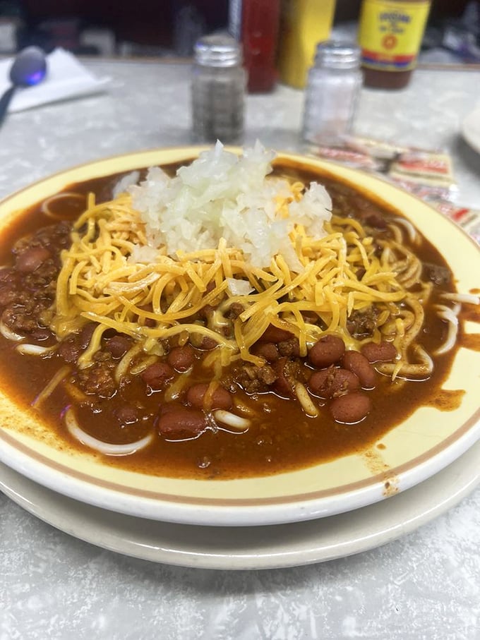 Bowl of chili that looks like it could warm you through an Indiana winter &ndash; cheese and onions standing at attention.
