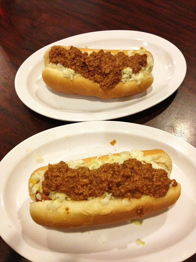 Two hot dogs dressed to the nines, proving that even simple pleasures deserve the royal treatment here.
