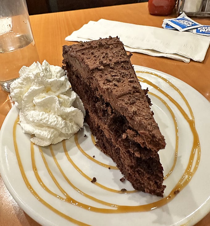 A chocolate cake so rich it probably owns lakefront property, with a dollop of whipped cream that's not just for show.