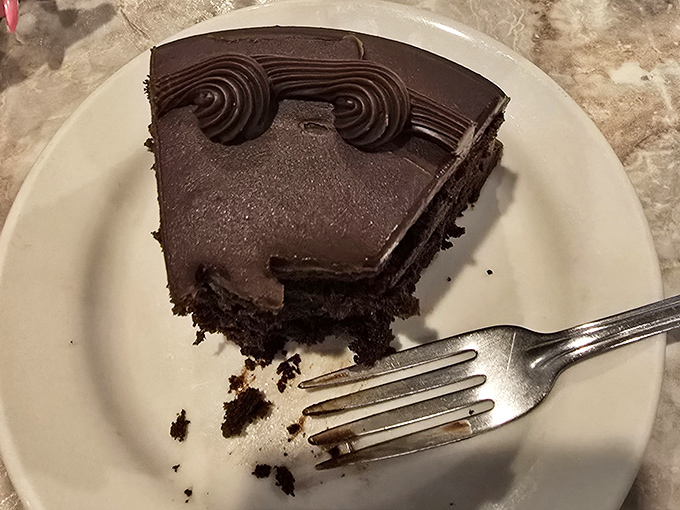 Dark, decadent, and towering with chocolate confidence&mdash;this cake doesn't whisper, it announces its presence with authority and frosting.