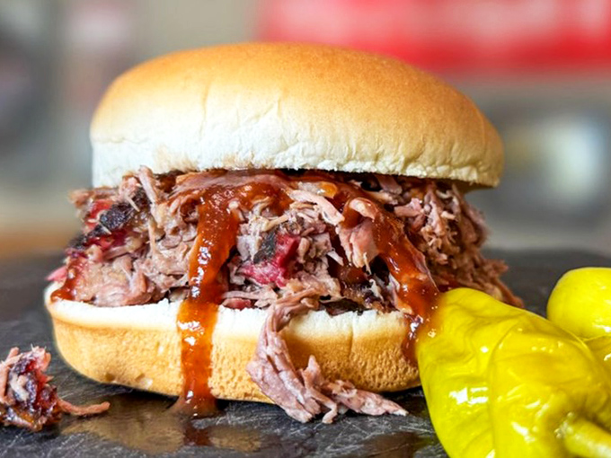 The chopped brisket sandwich &ndash; where smoke-kissed beef meets pillowy bun in a romance that puts most rom-coms to shame. Those pickles aren't just garnish; they're supporting actors.