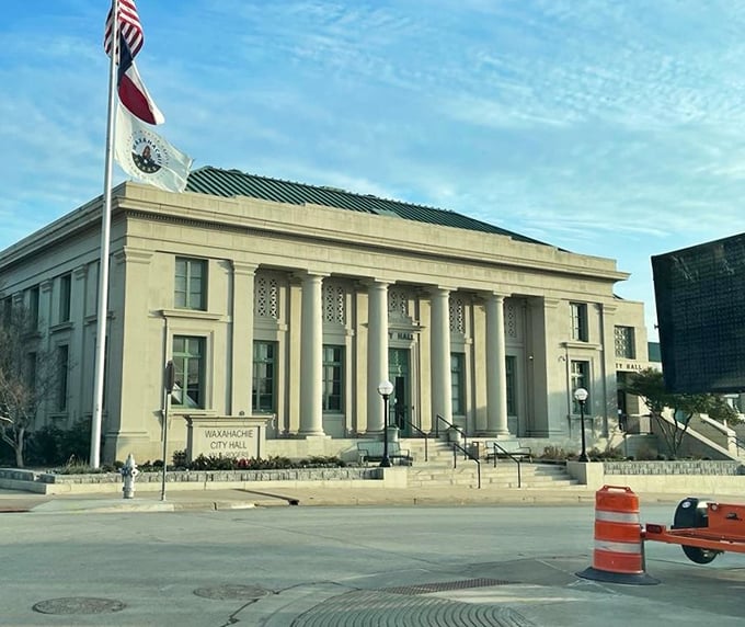 City Hall's imposing columns and flags remind us that even small-town governance deserves architectural gravitas. Democracy looks good in limestone.