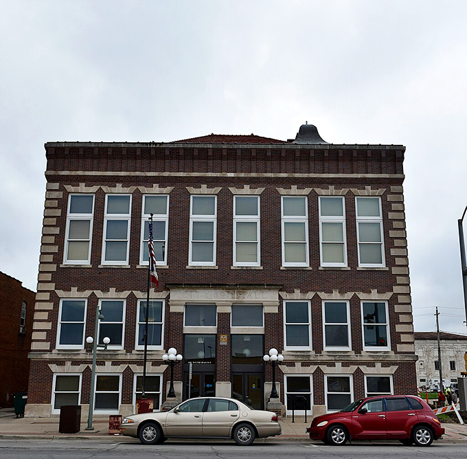 This stately brick building houses city services where small-town efficiency means your tax dollars work harder than a Midwesterner with two jobs.