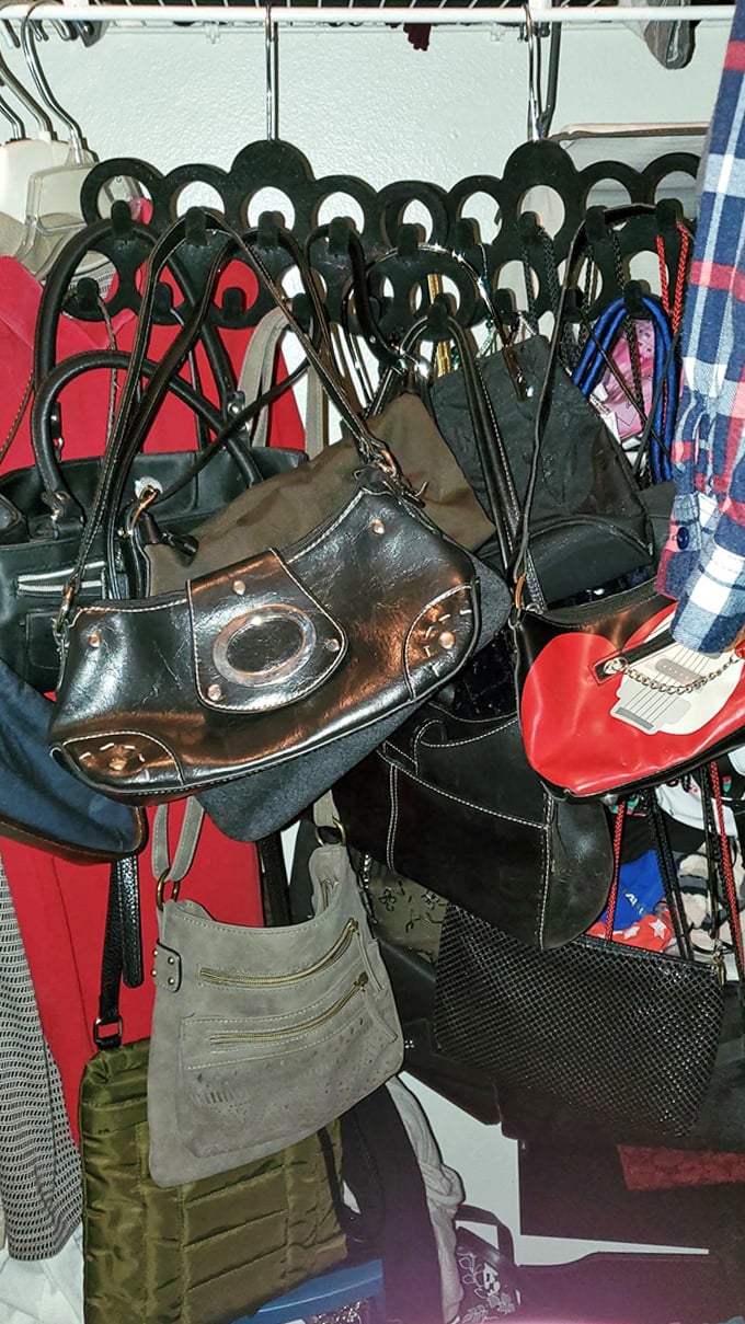 Handbags hang like exotic fruit, each with its own history and character, waiting for the right shoulder to come along.