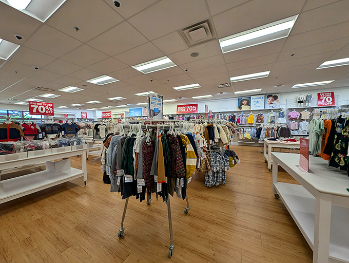 Racks of discounted designer clothes await their forever homes, like hopeful puppies with better fashion sense and lower maintenance costs.
