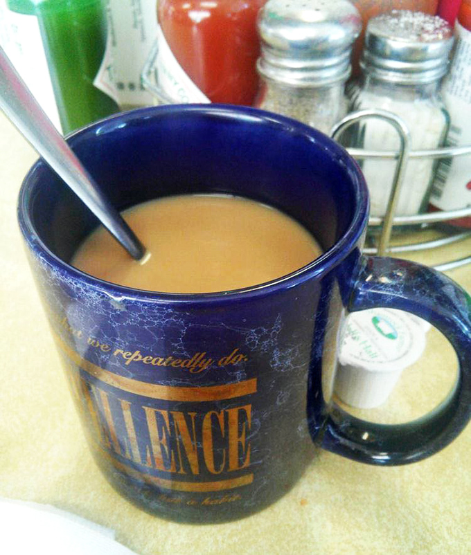 That blue coffee mug has seen things. The perfect vessel for the lifeblood of diners everywhere &ndash; bottomless, unpretentious, and absolutely essential.