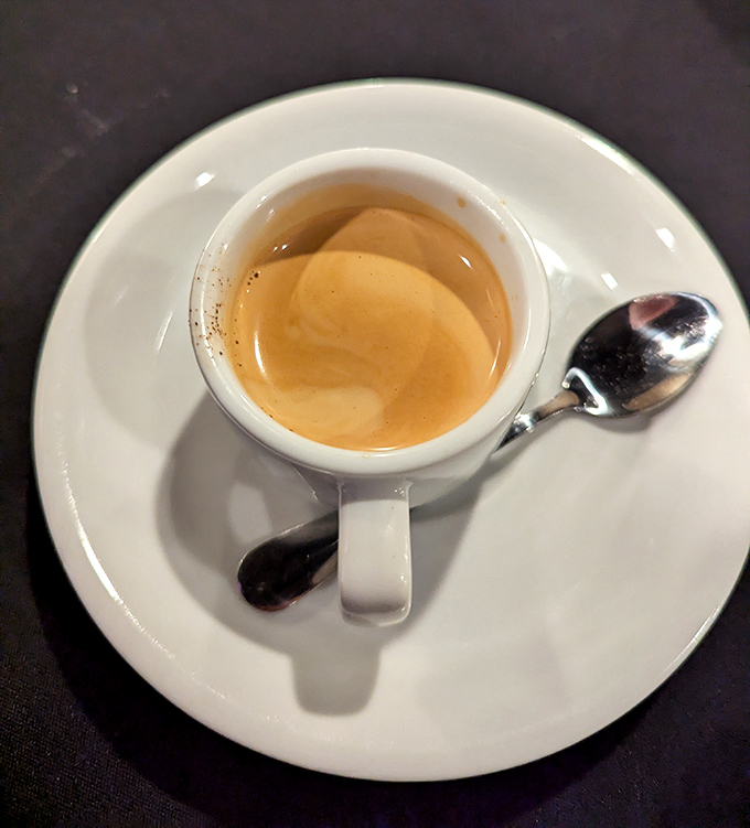 The espresso arrives in its proper tiny cup, promising the kind of caffeine revelation that makes Italian afternoons possible.