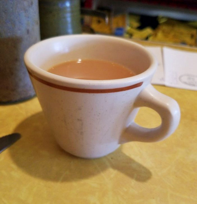 That simple white mug against the yellow counter tells you everything&mdash;no fancy latte art needed when the coffee is this good.