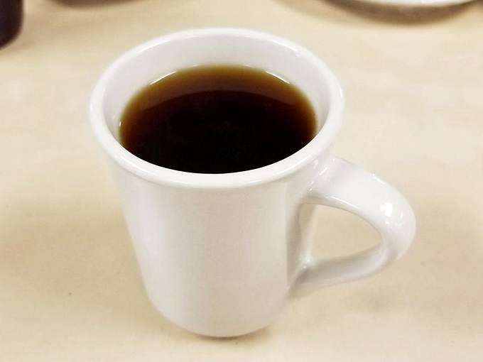 Strong, honest coffee that tastes like coffee should, served in a proper ceramic mug.