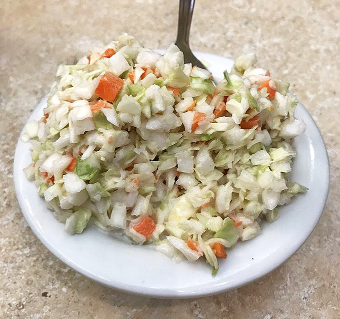 Fresh, crisp coleslaw &ndash; the unsung hero of diner sides. This isn't an afterthought; it's a supporting actor worthy of its own award.