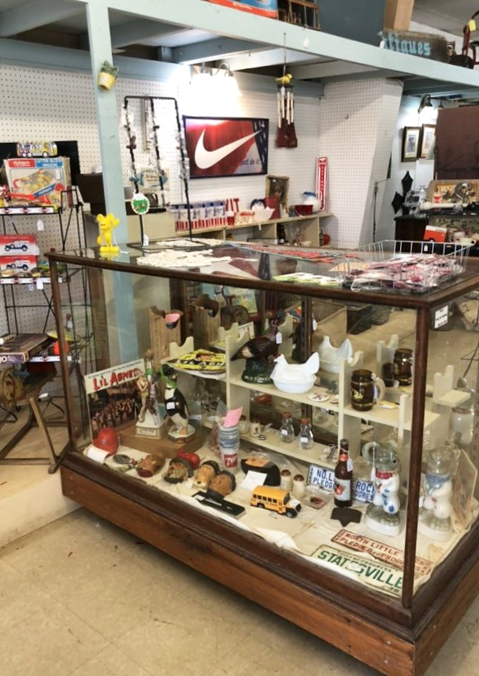 This display case is basically a time capsule with price tags. That vintage school bus would transport any Gen-Xer straight back to Saturday morning cartoons.