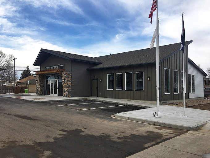 This modern community center with its welcoming stone entrance and flagpoles represents Kersey's investment in bringing residents together.