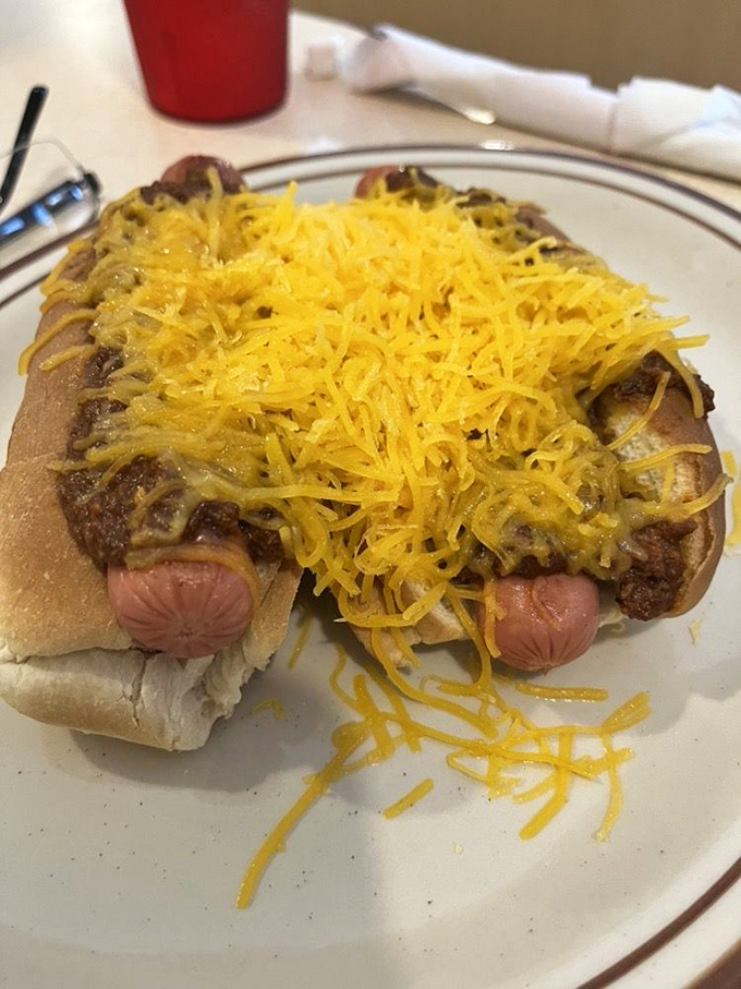 Cheese-smothered coneys that don't need fancy toppings to impress—just honest ingredients and the courage to embrace delicious messiness.