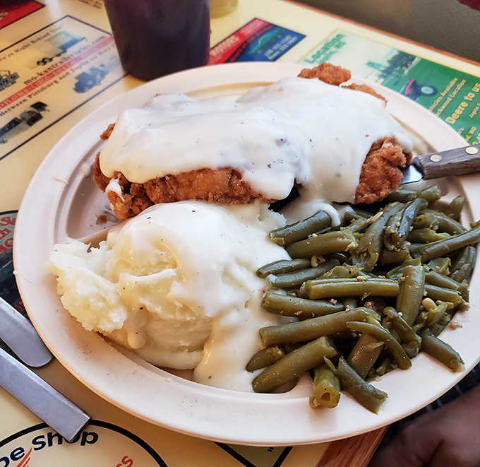 Country fried steak swimming in gravy with sides that make you want to write love letters to whoever's in the kitchen.