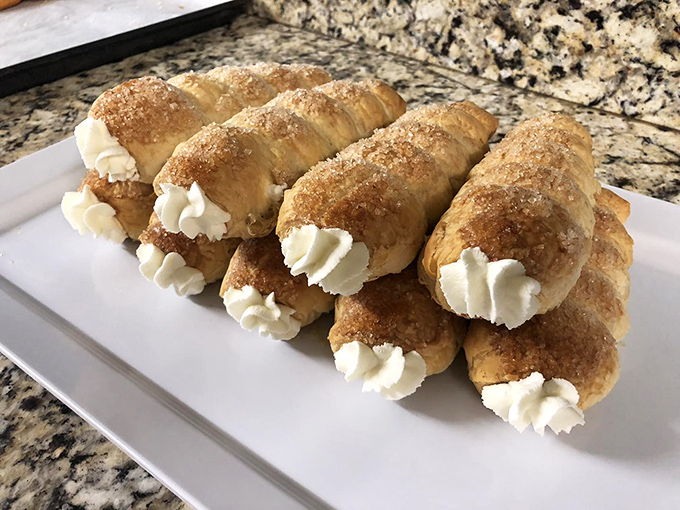 Cream horns that combine the best of both worlds: crunchy cinnamon-sugar exteriors with clouds of vanilla cream inside.