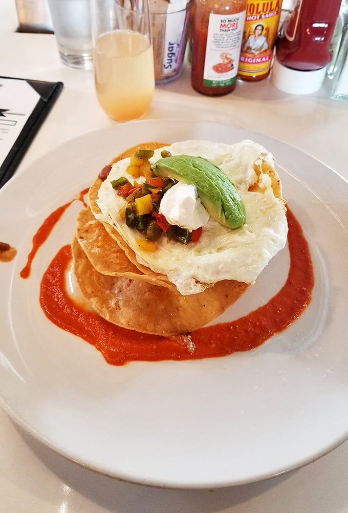 Huevos Rancheros elevated to art form. That perfectly placed avocado slice is like the cherry on top of a savory, southwestern sundae.