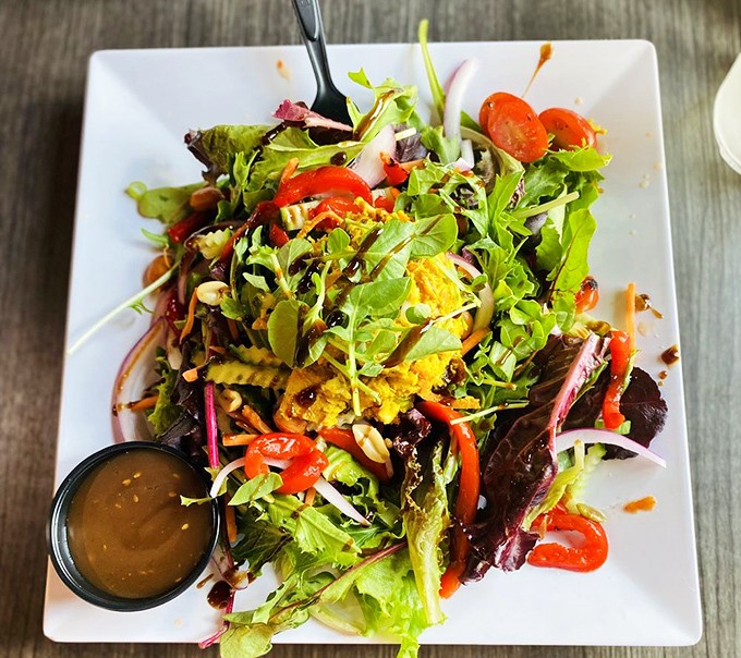 A salad that actually excites&mdash;bright greens, vibrant veggies, and curry chicken that makes you wonder why you ever settled for boring lunch options.