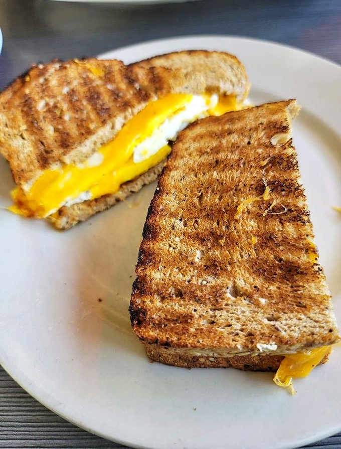 The breakfast sandwich that makes all other sandwiches question their life choices. That molten cheese center is pure morning motivation.