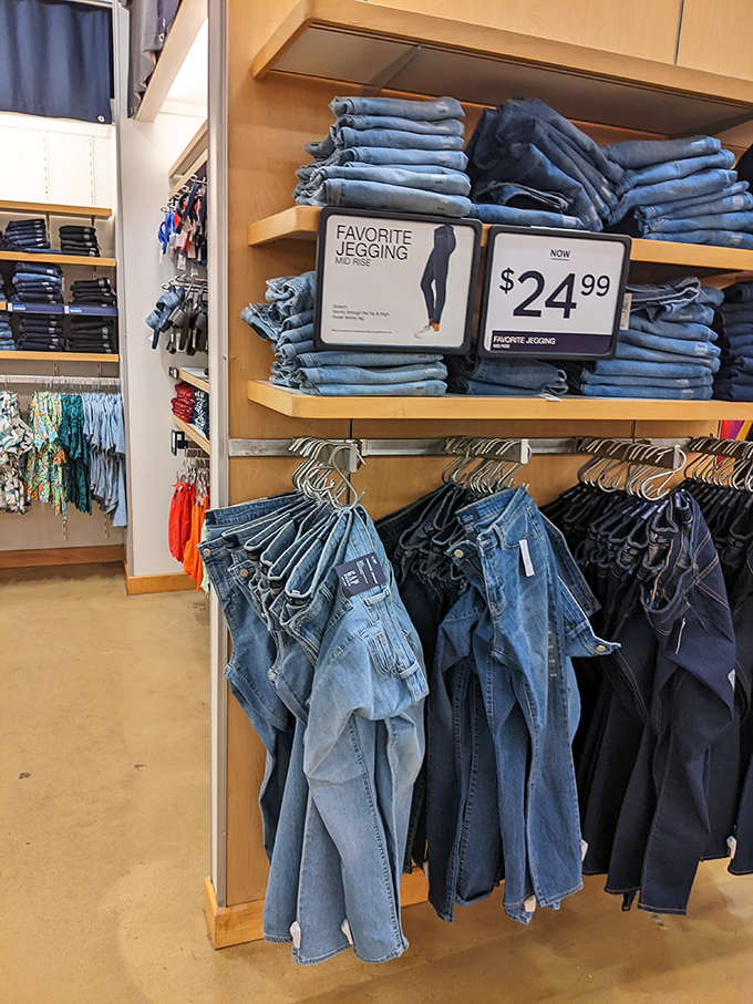 Denim paradise where jeans are stacked higher than your laundry pile at home—each pair promising to be "the ones" that finally fit perfectly.
