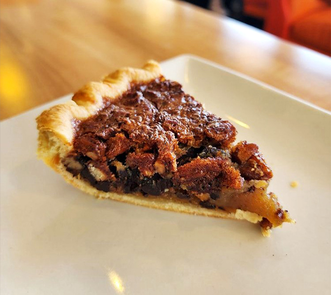 A slice of Derby Pie that doesn't need the Kentucky Derby to be a winner. The perfect ratio of gooey filling to flaky crust.