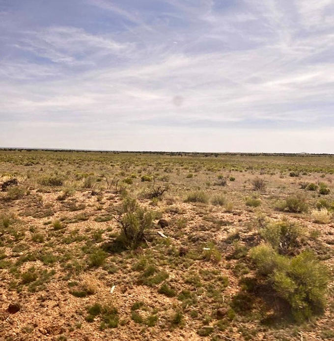 Before reaching the falls, you'll traverse this seemingly endless desert landscape, making the eventual waterfall reveal all the more jaw-dropping.