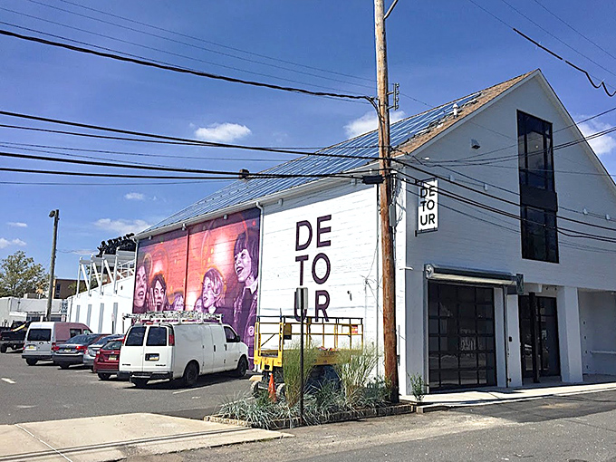 Detour Art Gallery's bold exterior mural signals Red Bank's artistic soul. Even the buildings here tell stories through color and form.