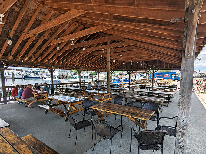 Where wooden beams frame waterfront memories. The pavilion's rustic charm creates the perfect backdrop for seafood feasting.