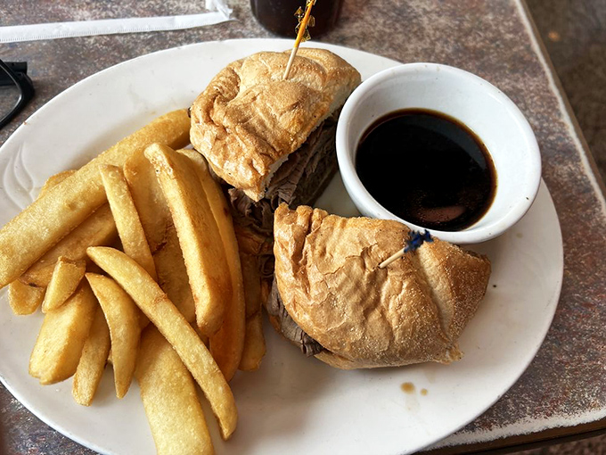 A classic French dip sandwich with crispy fries &ndash; simplicity executed with the confidence that comes from decades of practice.