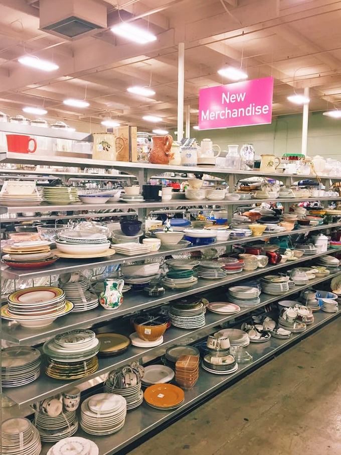 Dishware stacked high creates a ceramic symphony of patterns, perfect for hosting dinner parties on a shoestring budget.