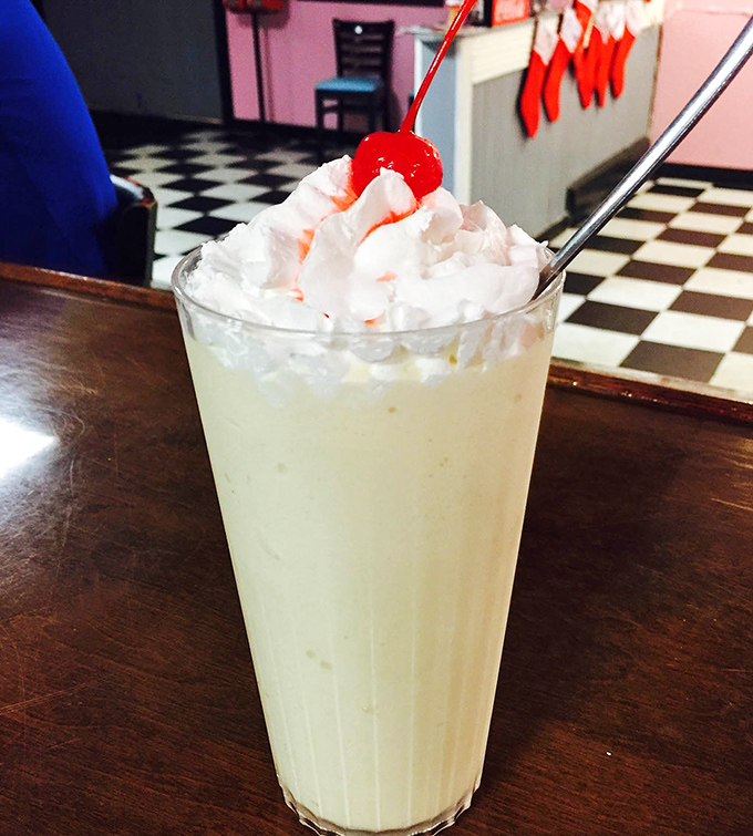 This isn't just a milkshake—it's a dessert skyscraper topped with whipped cream and childhood memories. Straws need not apply.