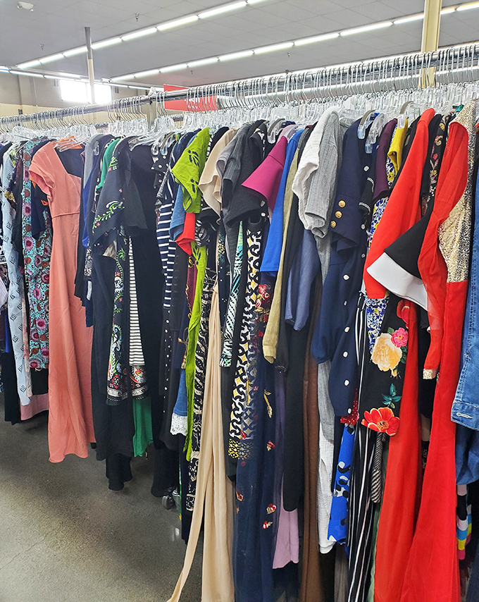 A rainbow of fabrics and patterns on the dress rack &ndash; each garment with its own story and waiting for you to write its next chapter.