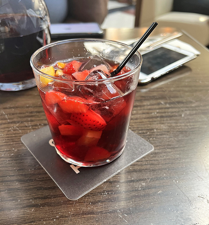 A gathering of happy diners sharing stories and meals&mdash;the universal language of "pass that plate over here, I need to try what you're having."