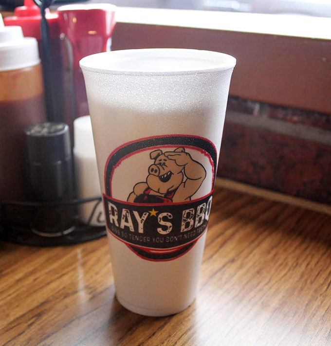 The cup says it all &ndash; "Ray's BBQ" &ndash; a vessel of promise holding sweet tea that cuts through smoky richness like a well-timed punchline.