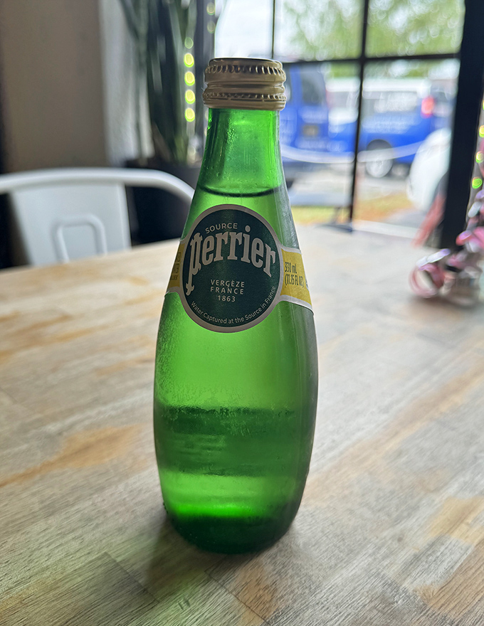 Nothing says "I'm sophisticated" quite like sipping Perrier while plotting which pastry to devour next.