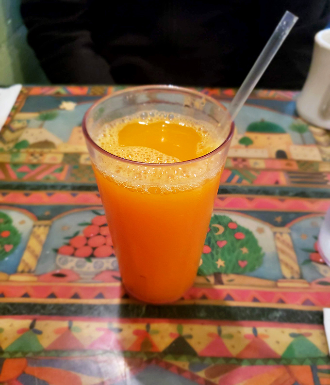 Fresh-squeezed orange juice so vibrant it practically glows&mdash;like drinking liquid sunshine with a frothy crown that no store-bought version can touch.