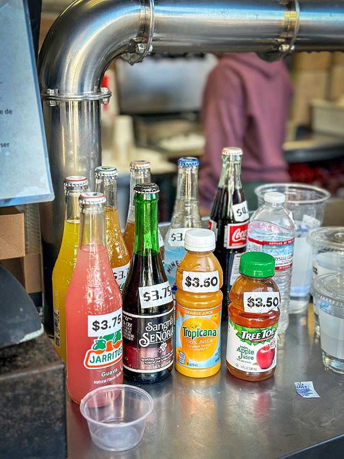 Colorful sodas standing at attention, waiting to wash down your seafood feast with fizzy enthusiasm.