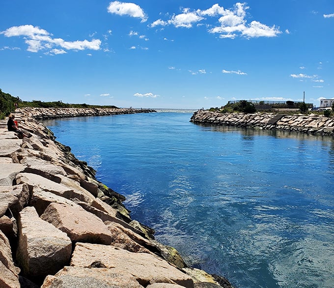 The harbor's jetties create a perfect frame for Westerly's brilliant blue waters, like nature decided to create its own picture-perfect postcard.