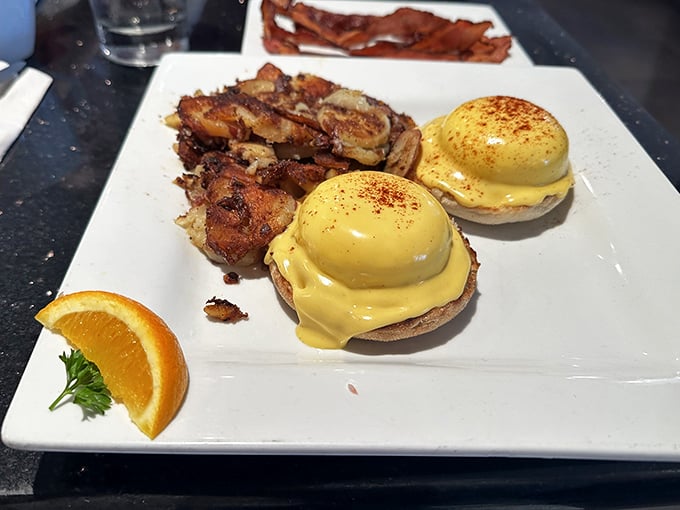 Eggs Benedict done right&mdash;those poached eggs perched so perfectly you'd think they were posing for their breakfast glamour shot, with hollandaise that glistens like liquid gold.