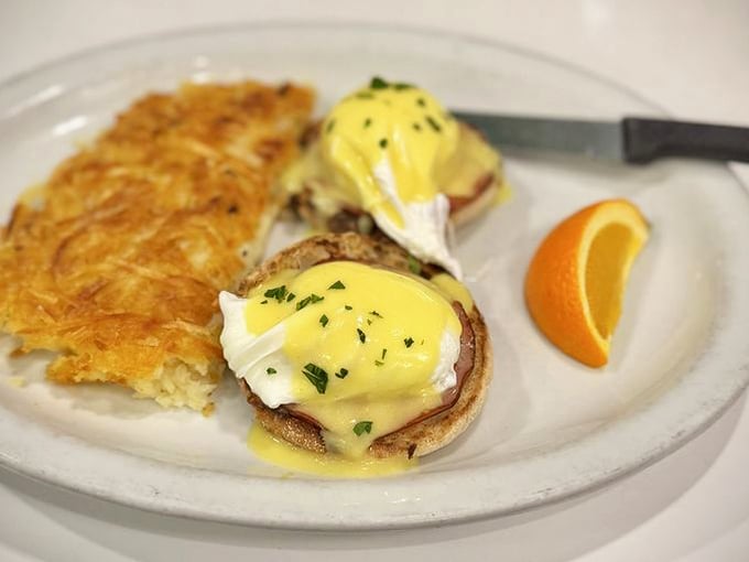 Eggs Benedict executed with textbook perfection: runny yolks, velvety hollandaise, and English muffins that actually hold their structure.