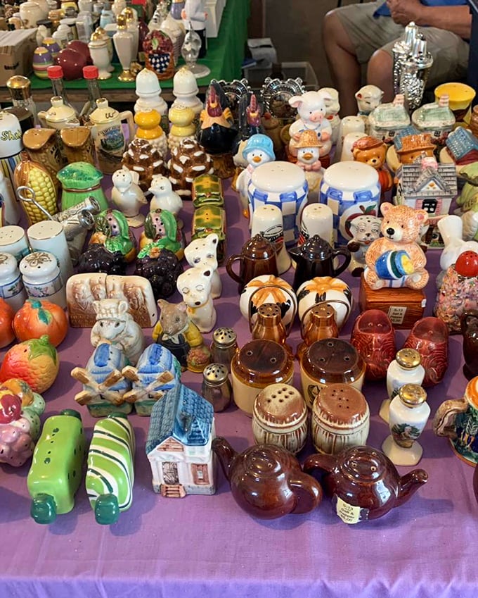 Grandma's china cabinet exploded onto this table! Vintage salt-and-pepper shakers, figurines, and ceramic treasures create a nostalgic wonderland of kitsch and charm.