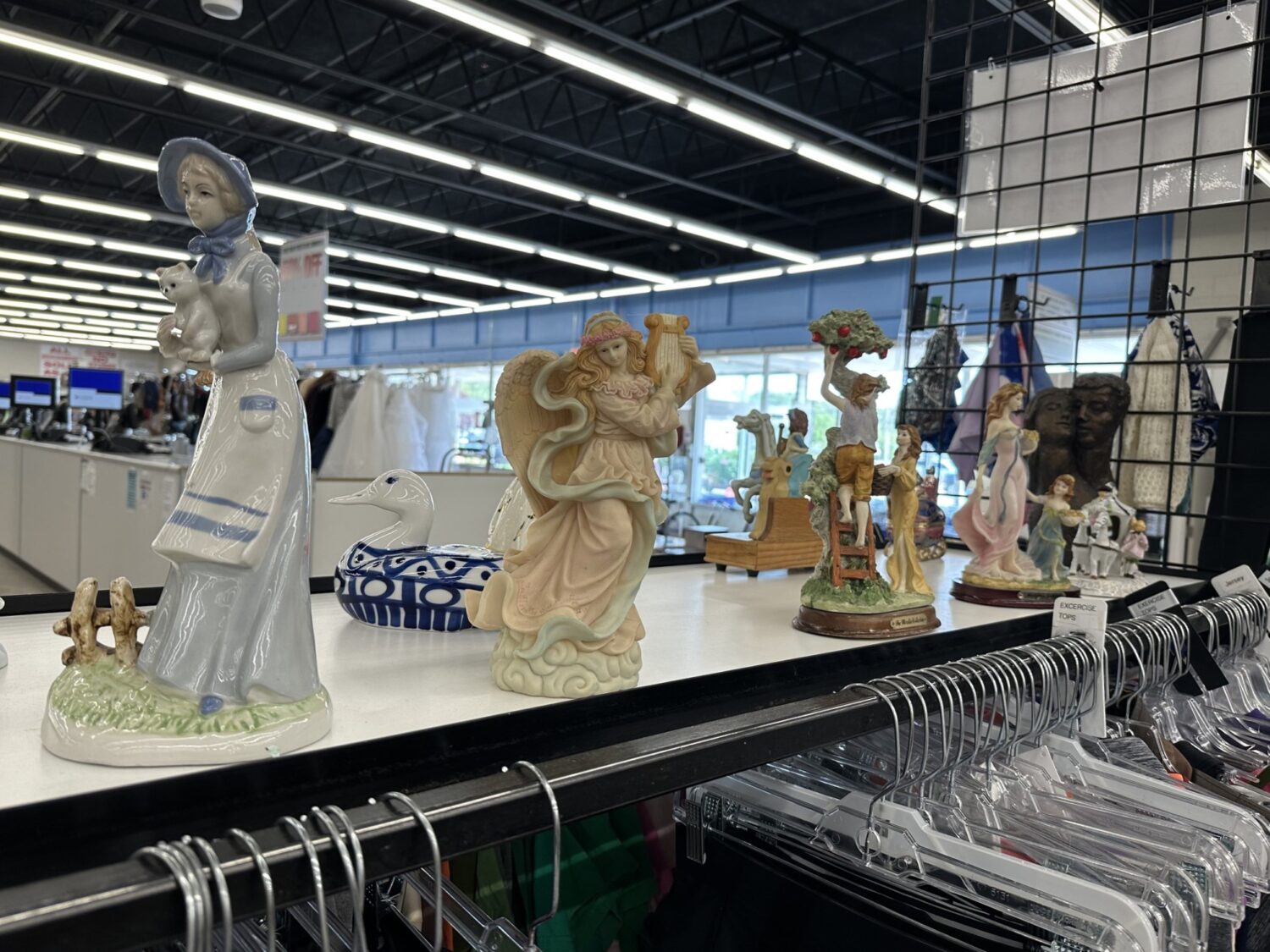 Delicate figurines stand at attention, waiting for new mantels to grace &ndash; one person's decluttered shelf becomes another's cherished collection.